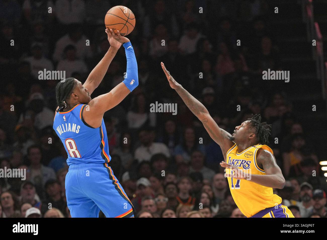 Oklahoma City Thunder forward Jalen Williams, left, shoots over Los ...