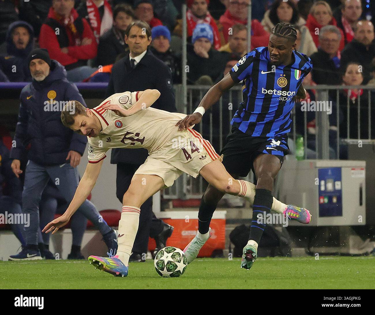 Munich, Germany. 8th Apr, 2025. Josip Stanisic (L) of Bayern Munich ...