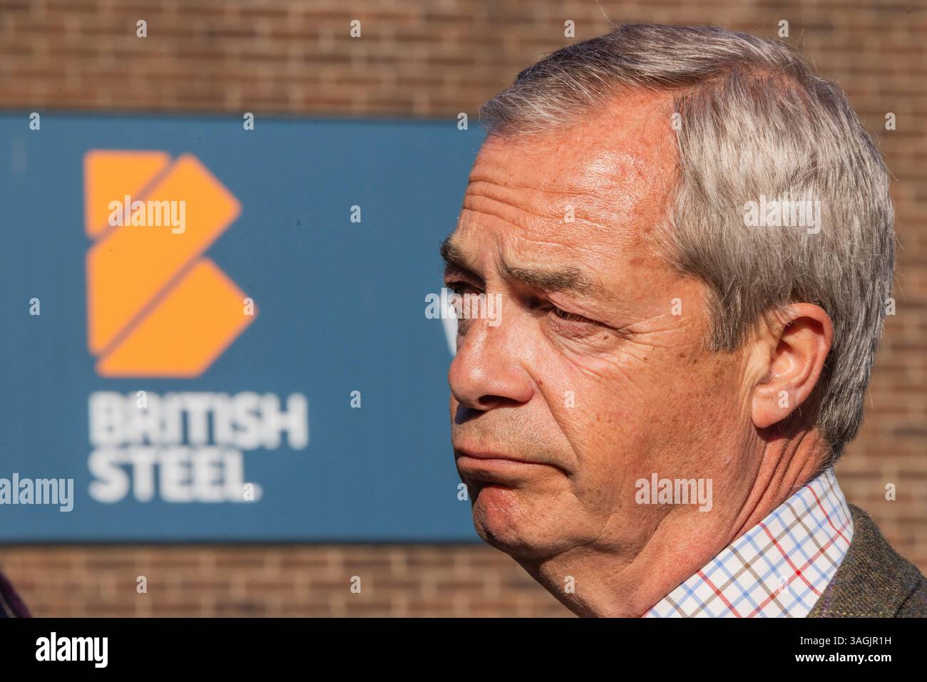 Scunthorpe, UK. 08 APR, 2025. Nigel Farage, leader of Reform UK, stands ...