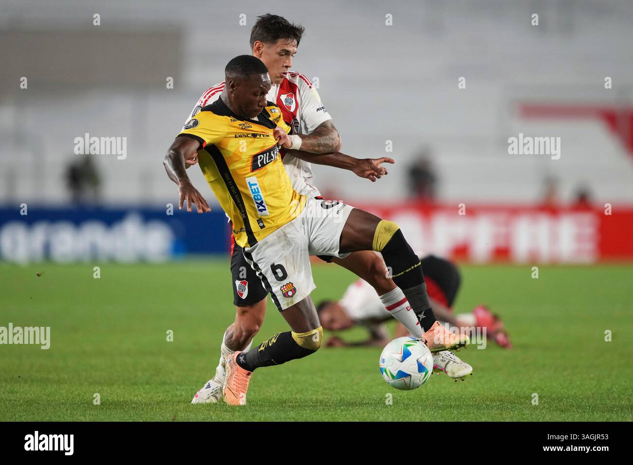 Anibal Chala of Ecuador's Barcelona, front, and Lucas Martinez of ...