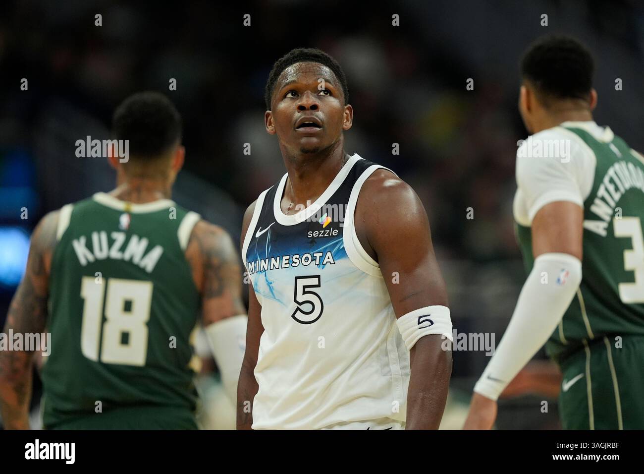Minnesota Timberwolves' Anthony Edwards (5) looks on during the first ...