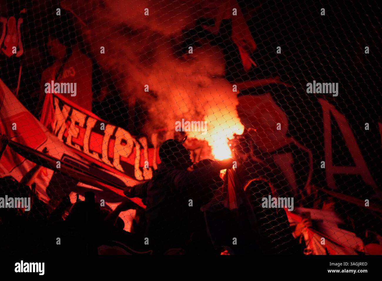 Fans of Chile's Universidad de Chile light flares during a Copa ...