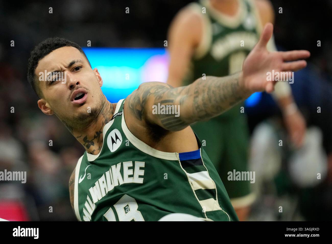 Milwaukee Bucks' Kyle Kuzma reacts to a call during the first half of ...