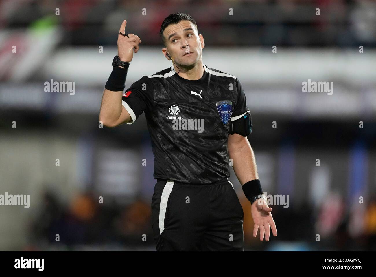 Referee Derlis Lopez, of Paraguay, gestures during a Copa Libertadores ...