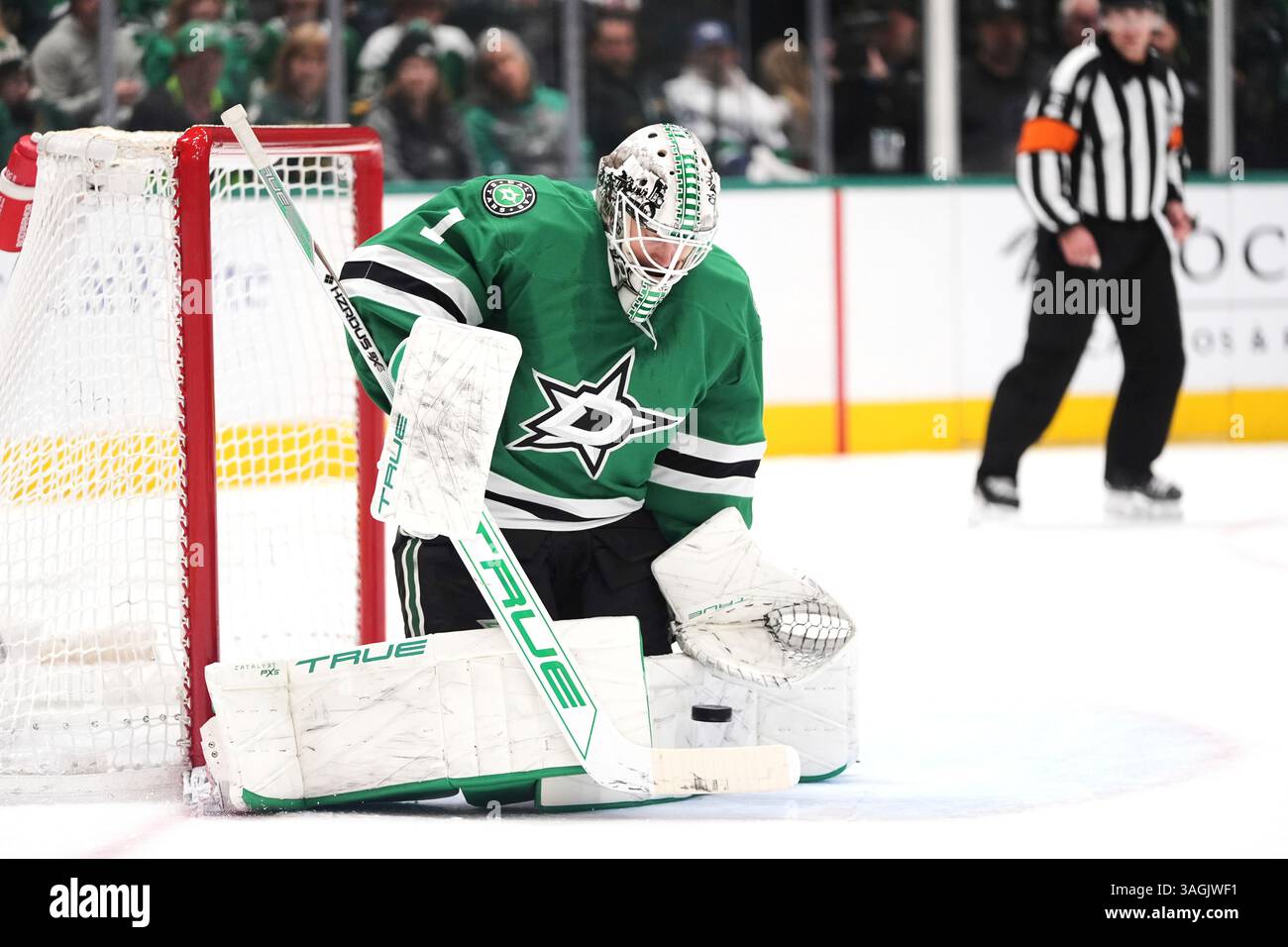 Dallas Stars goaltender Casey DeSmith blocks a shot from the Vancouver ...