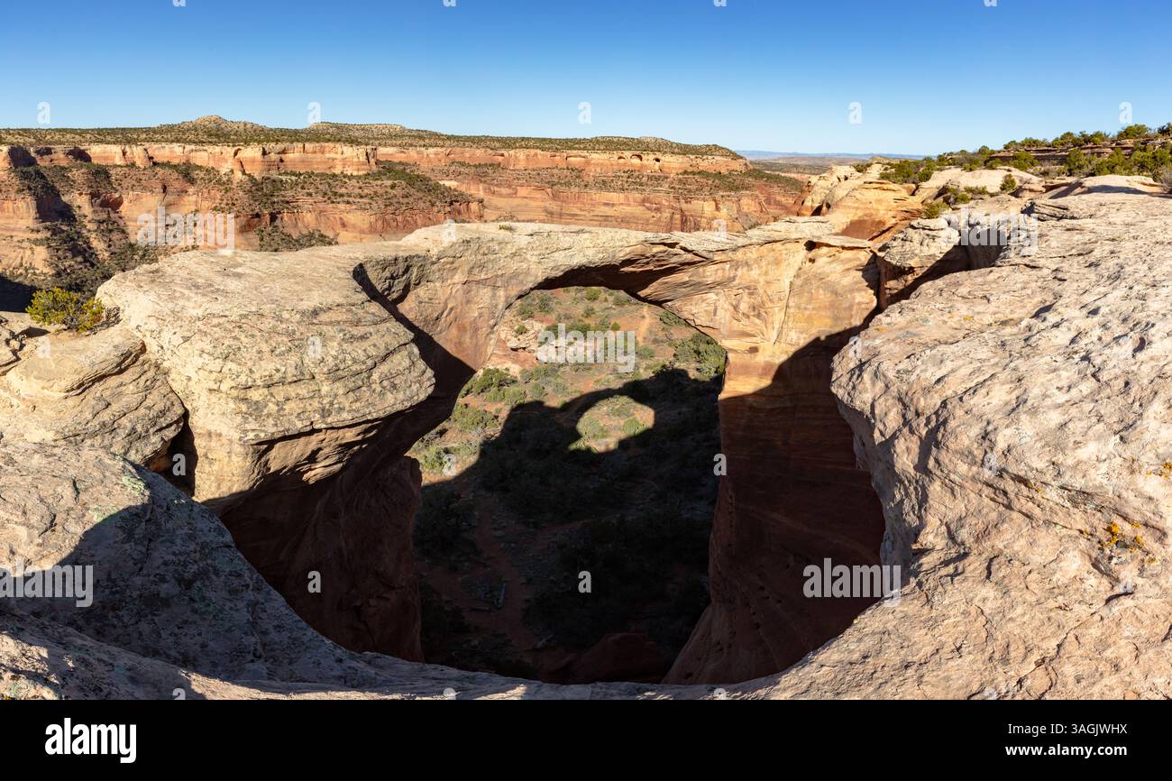 Rattlesnake arch and shadow from atop the cliffs in the Black Ridge ...