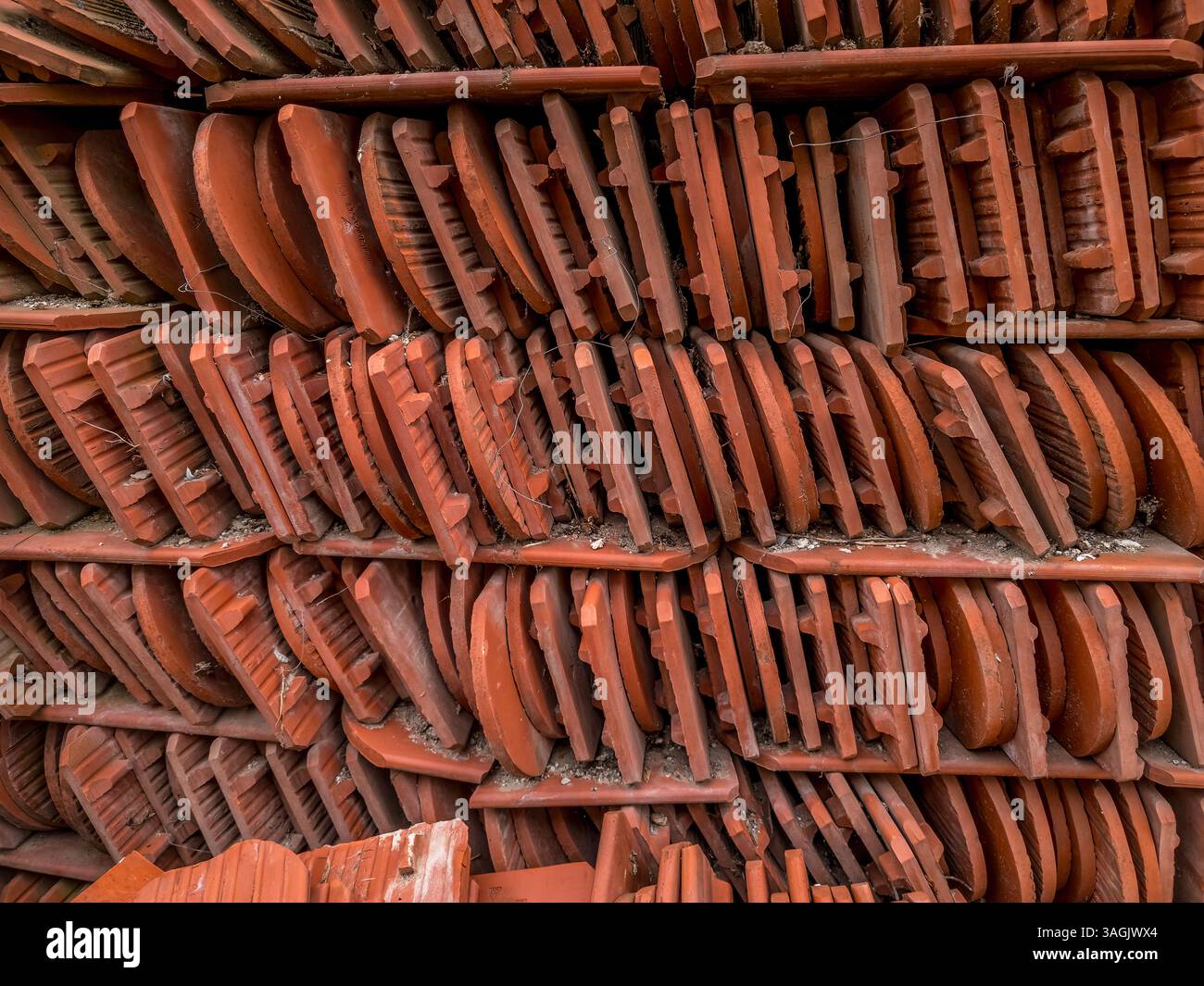 Stacked orange clay residential roof shingles Stock Photo - Alamy