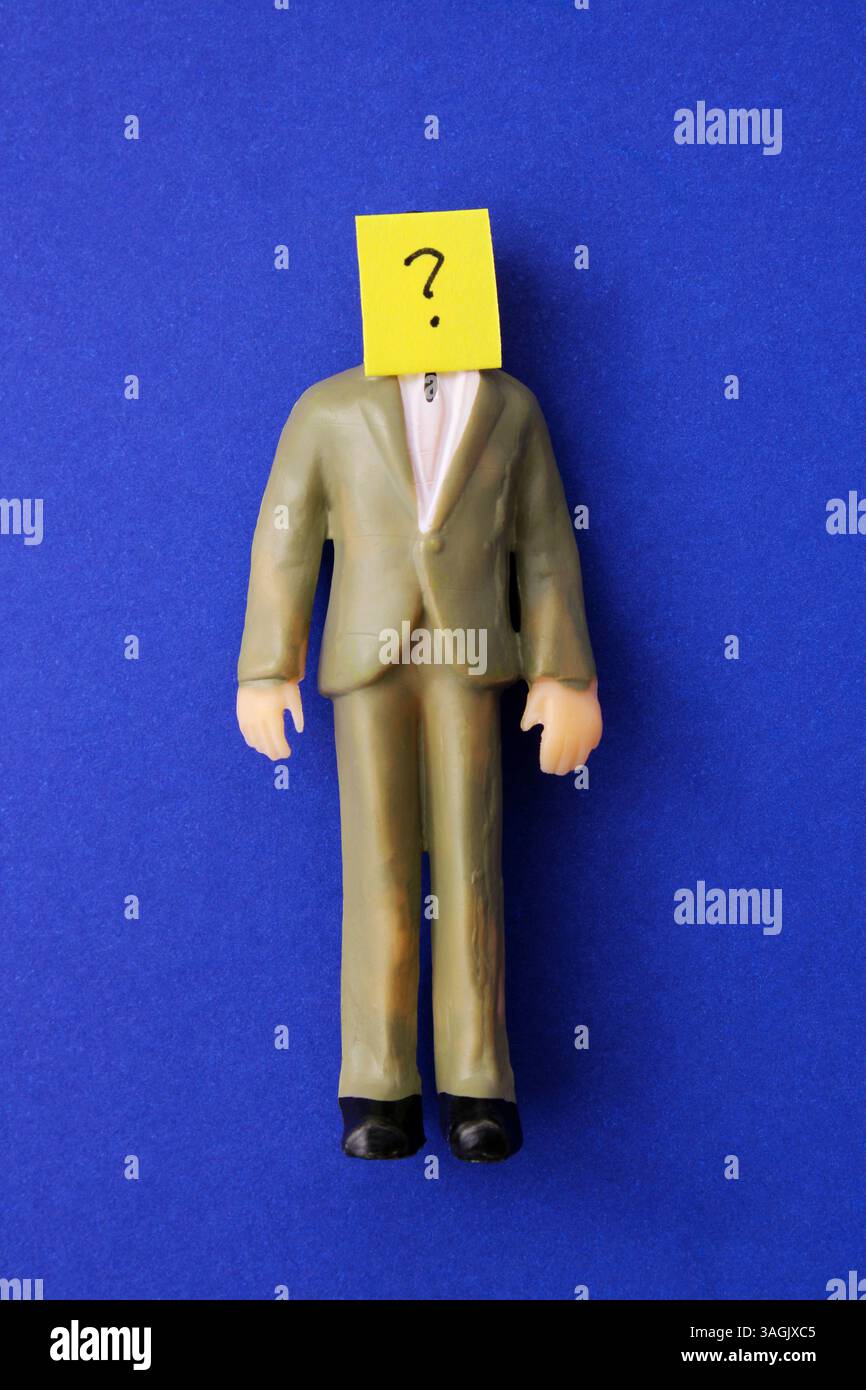 Business executive with his face covered with a question mark Stock ...