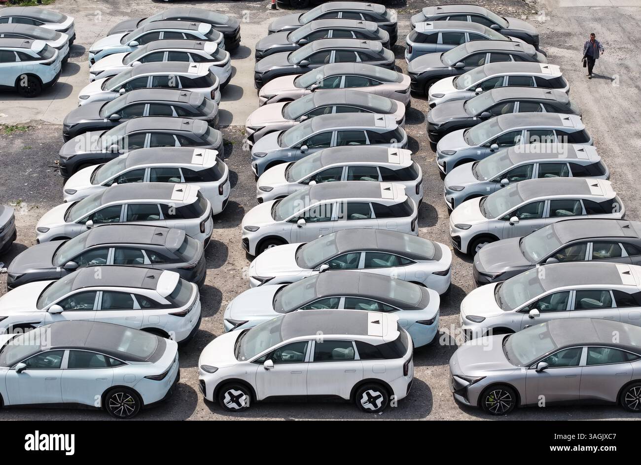 HANGZHOU, CHINA - APRIL 9, 2025 - Cars are parked at a temporary ...