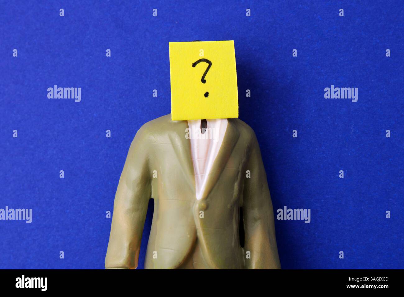 Businessman with his face covered with a question mark Stock Photo - Alamy