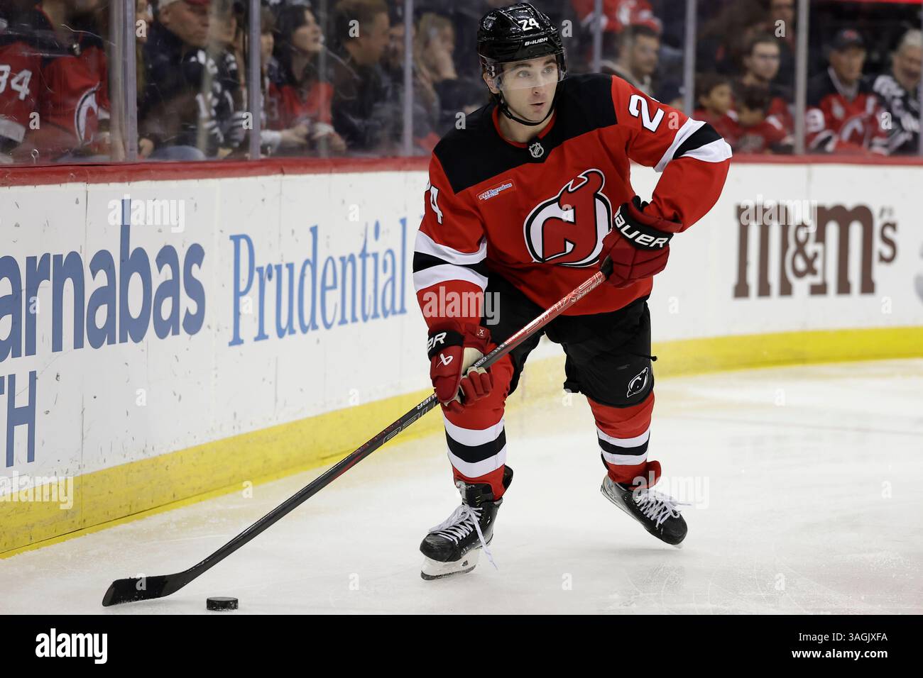 New Jersey Devils defenseman Seamus Casey (24) skates with the puck in ...