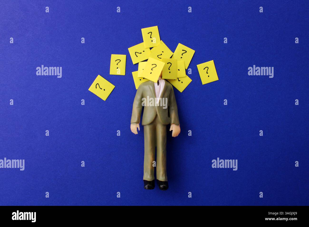 Business executive with his face covered with many question marks Stock ...