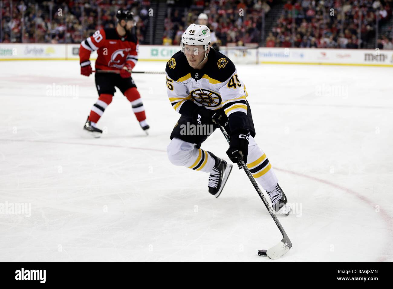 Boston Bruins left wing Cole Koepke (45) skates with the puck in the ...