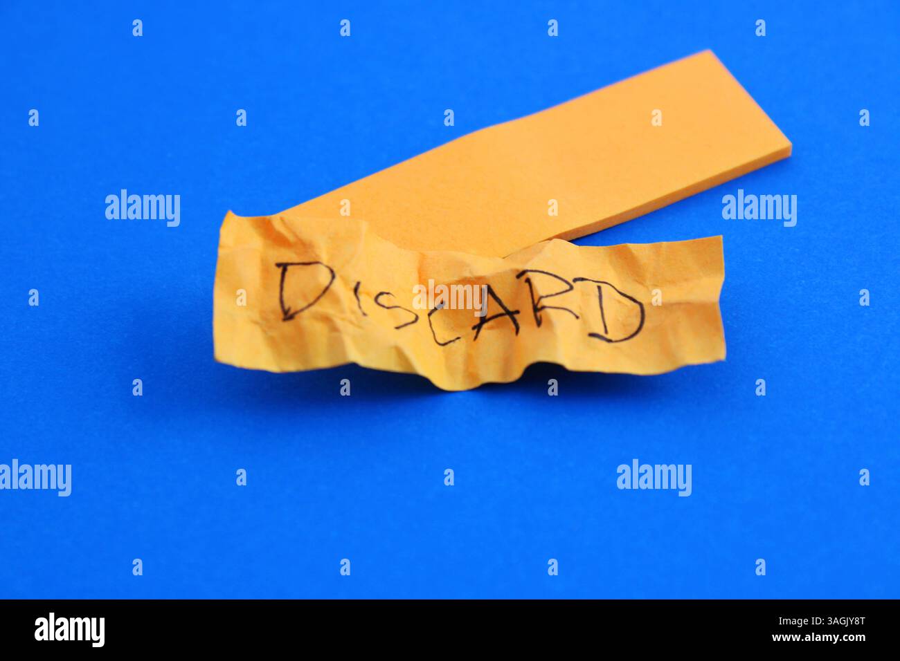 Crumpled and discarded sticky note Stock Photo - Alamy