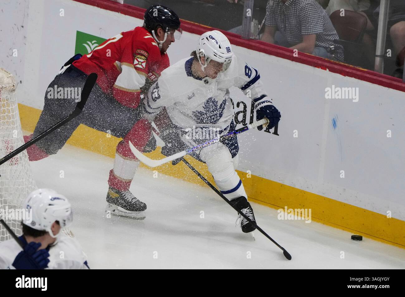 Florida Panthers defenseman Niko Mikkola, left, and Toronto Maple Leafs ...
