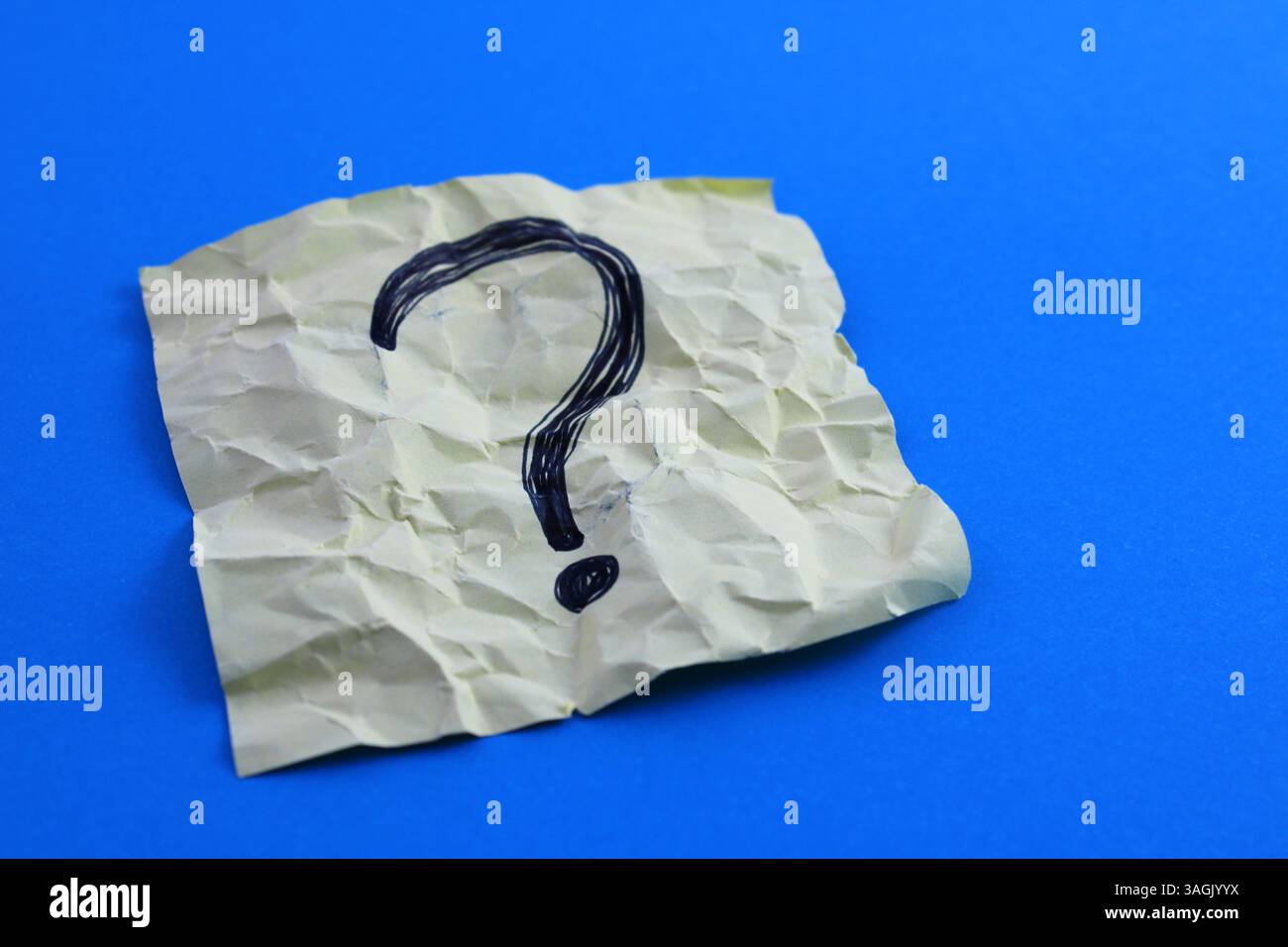 Crumpled sticky note with a question mark Stock Photo - Alamy
