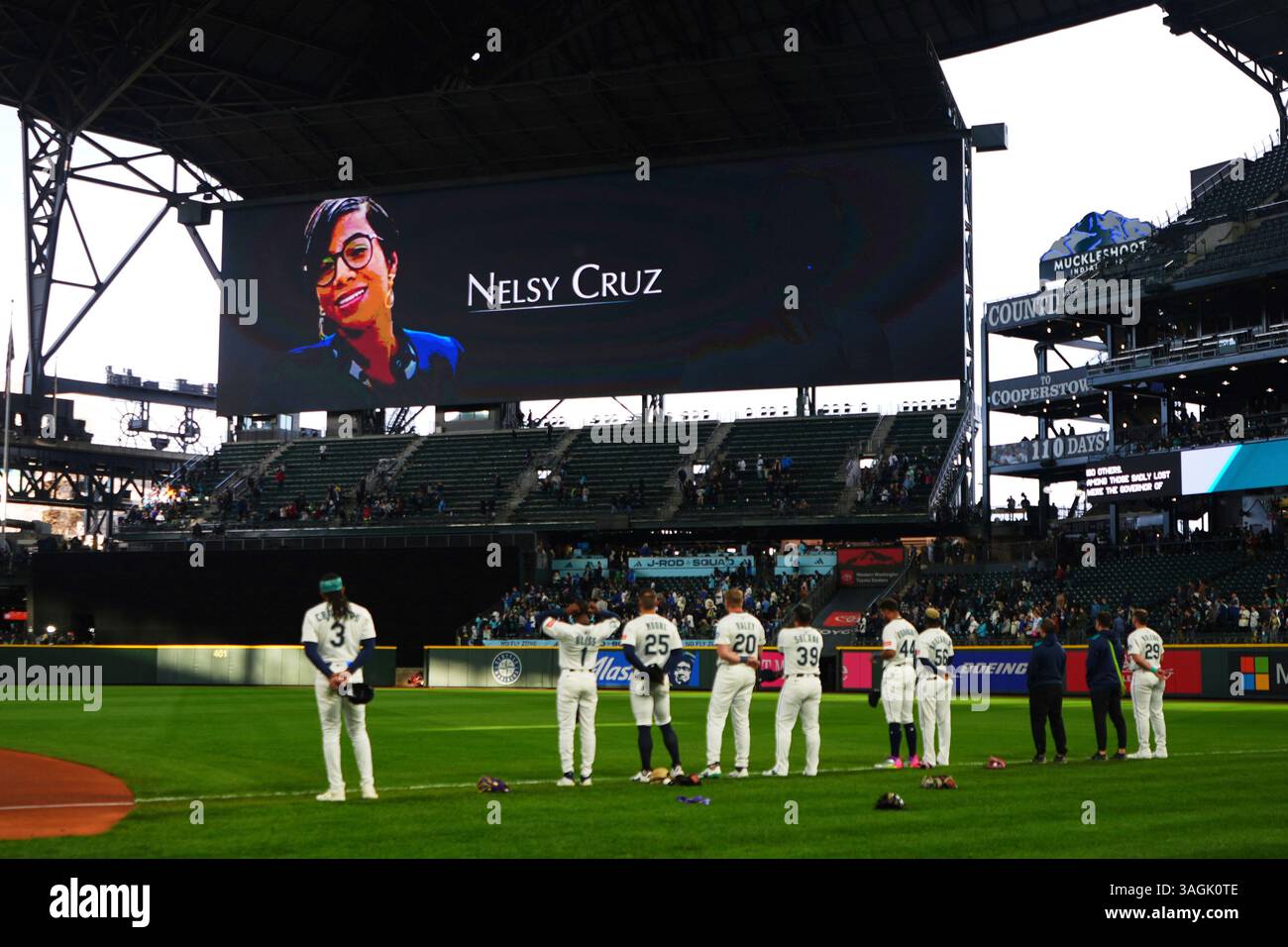 Members of the Seattle Mariners stand during a moment of silence for ...