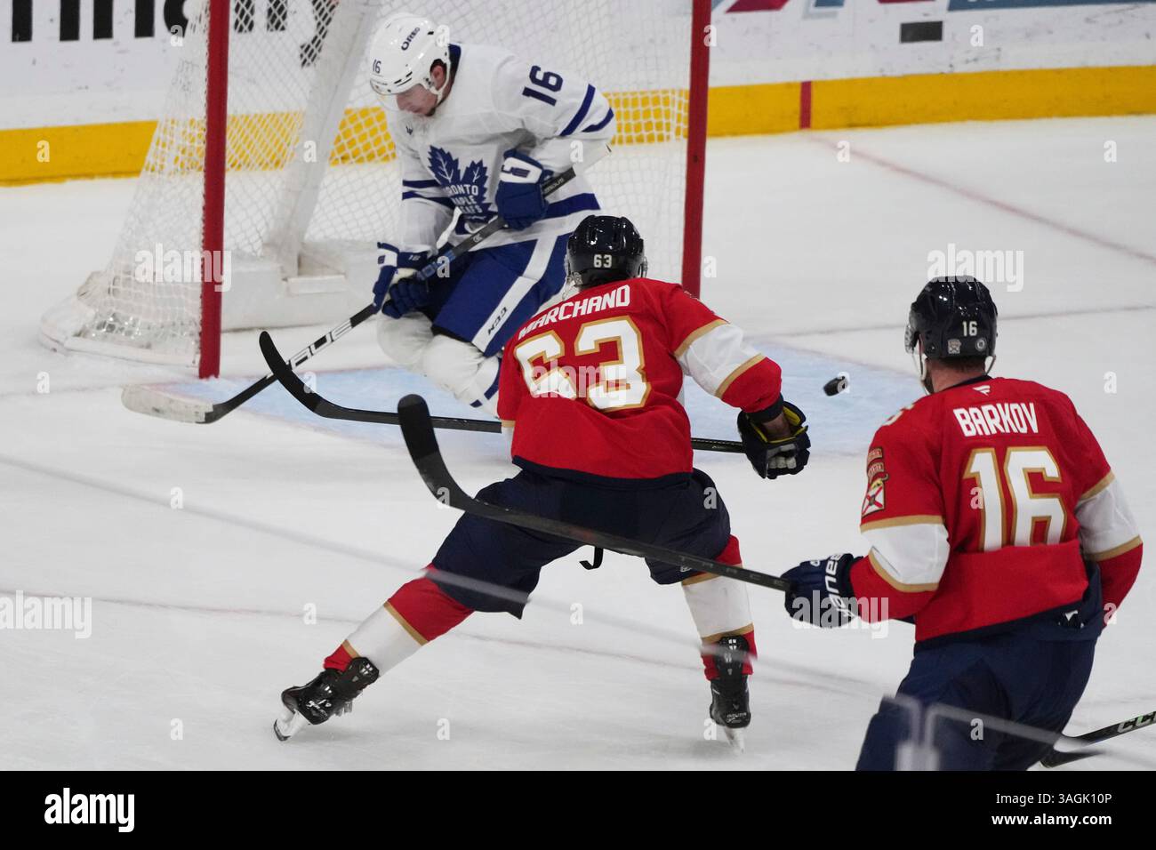 Toronto Maple Leafs right wing Mitch Marner (16) defends a shot on the ...