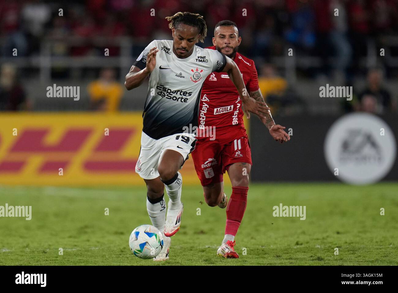 Andre Carrillo of Brazil's Corinthians, left, escapes with the ball ...