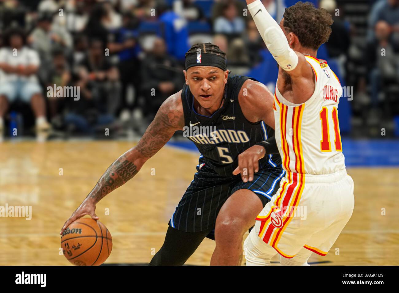 Orlando, Florida, USA, April 8, 2025, Orlando Magic forward Paolo Banchero 35 rush pass Trae ...