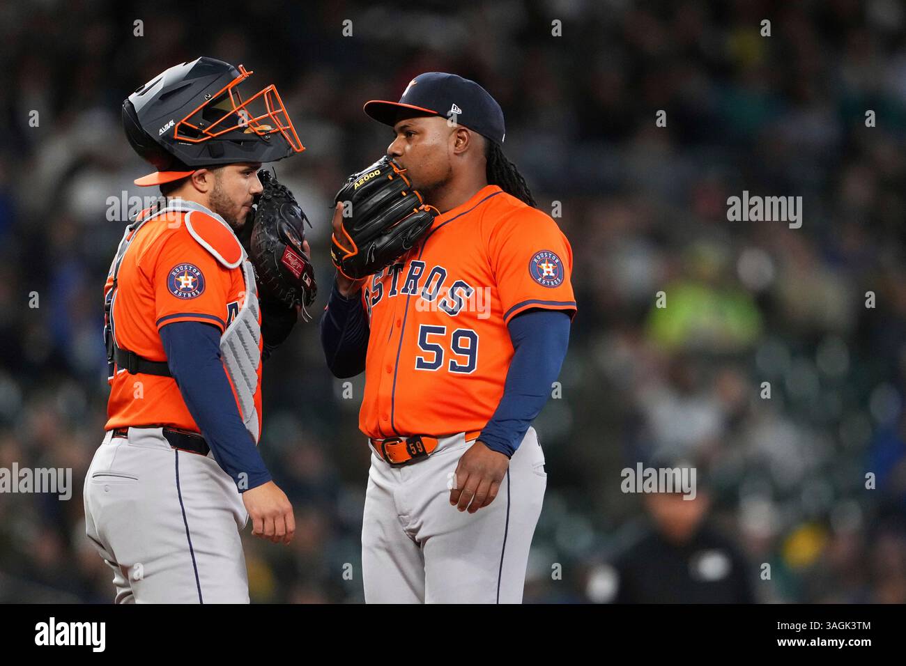 Houston Astros catcher Yainer Diaz, left, talks with starting pitcher Framber Valdez, right ...