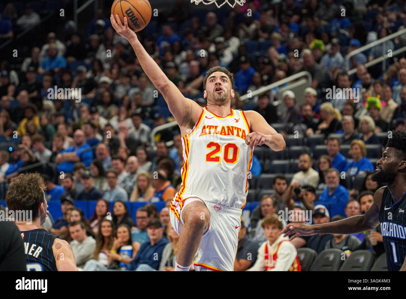 Orlando, Florida, USA, April 8, 2025, Atlanta Hawks forward Georges Niang #20 attempt to score ...