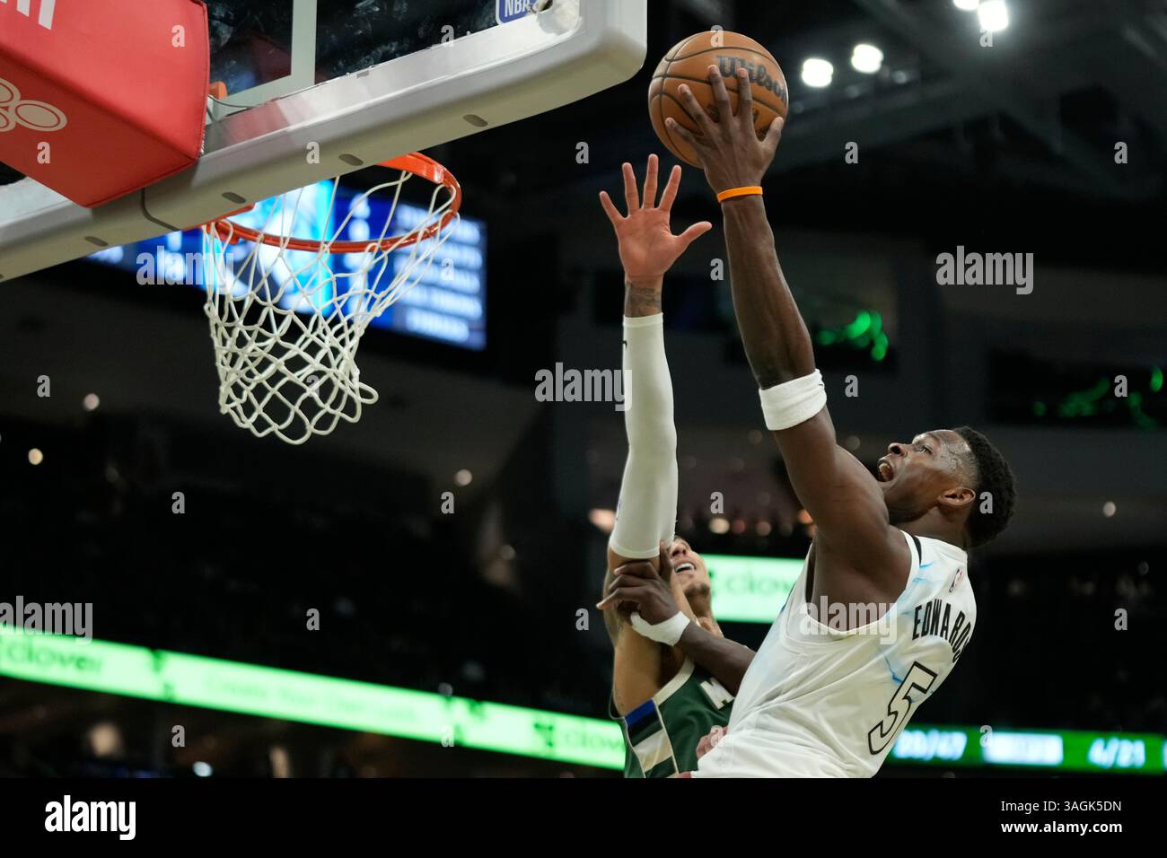 Minnesota Timberwolves' Anthony Edwards (5) shoots against Milwaukee Bucks' Kyle Kuzma during ...