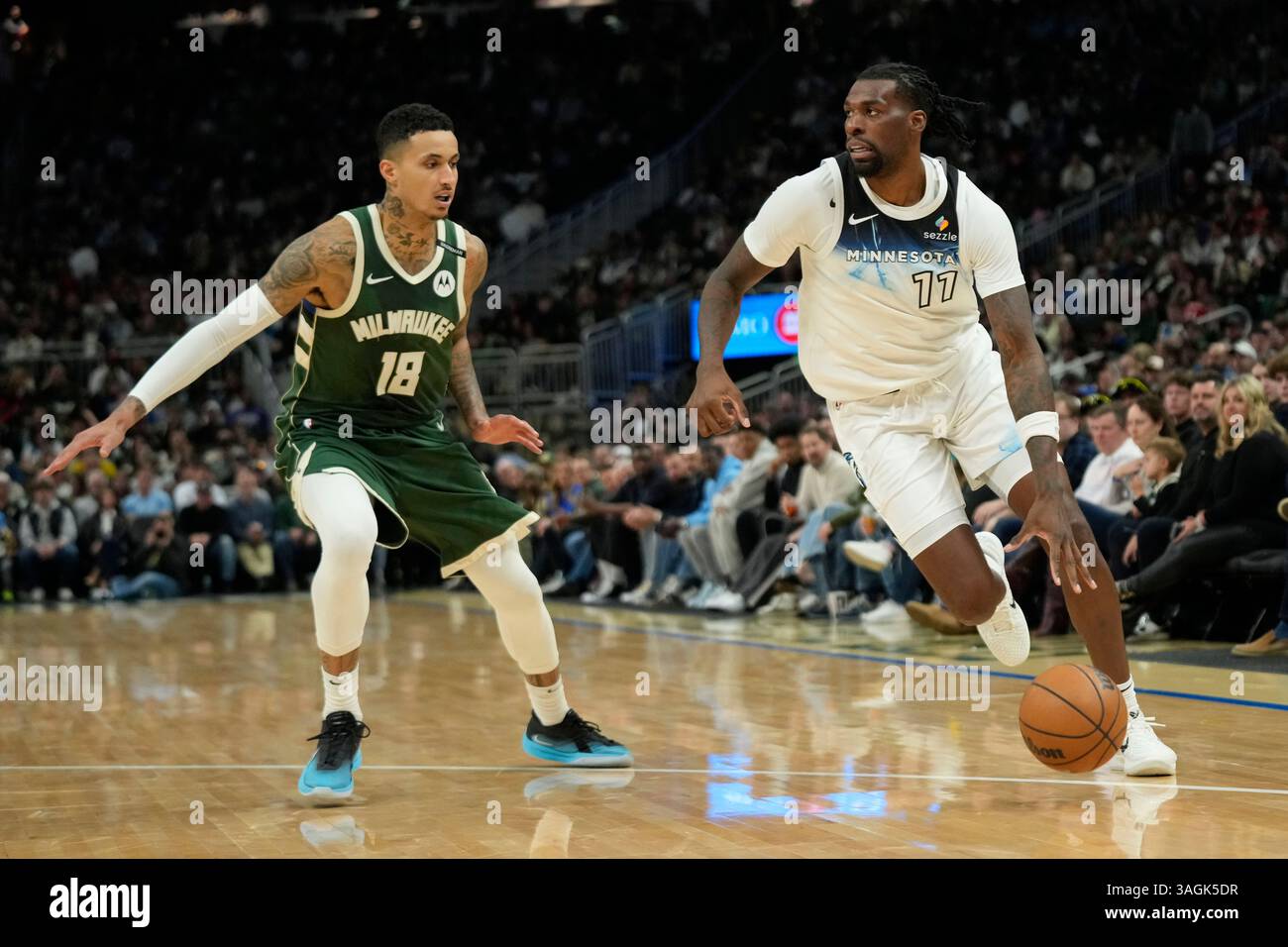 Minnesota Timberwolves' Naz Reid (11) drives to the basket against ...