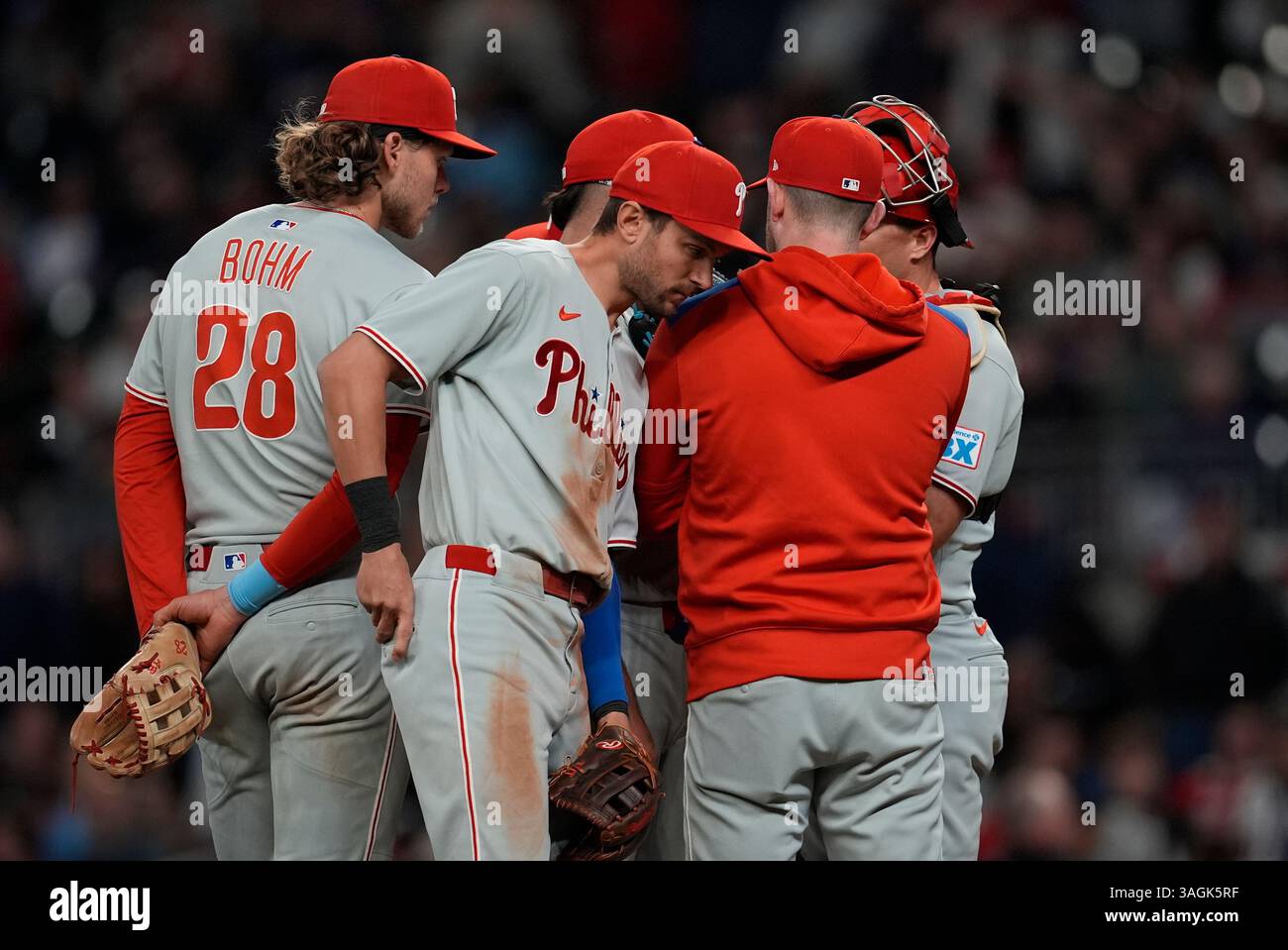 The Philadelphia Phillies huddle on the mound with pitcher Orion ...