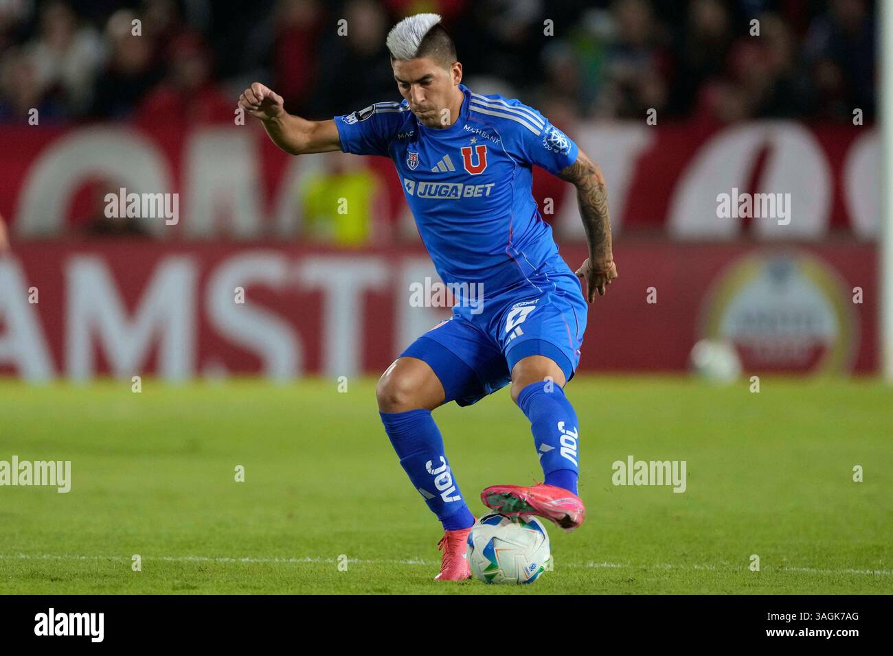 Leandro Fernandez of Chile's Universidad de Chile controls the ball ...
