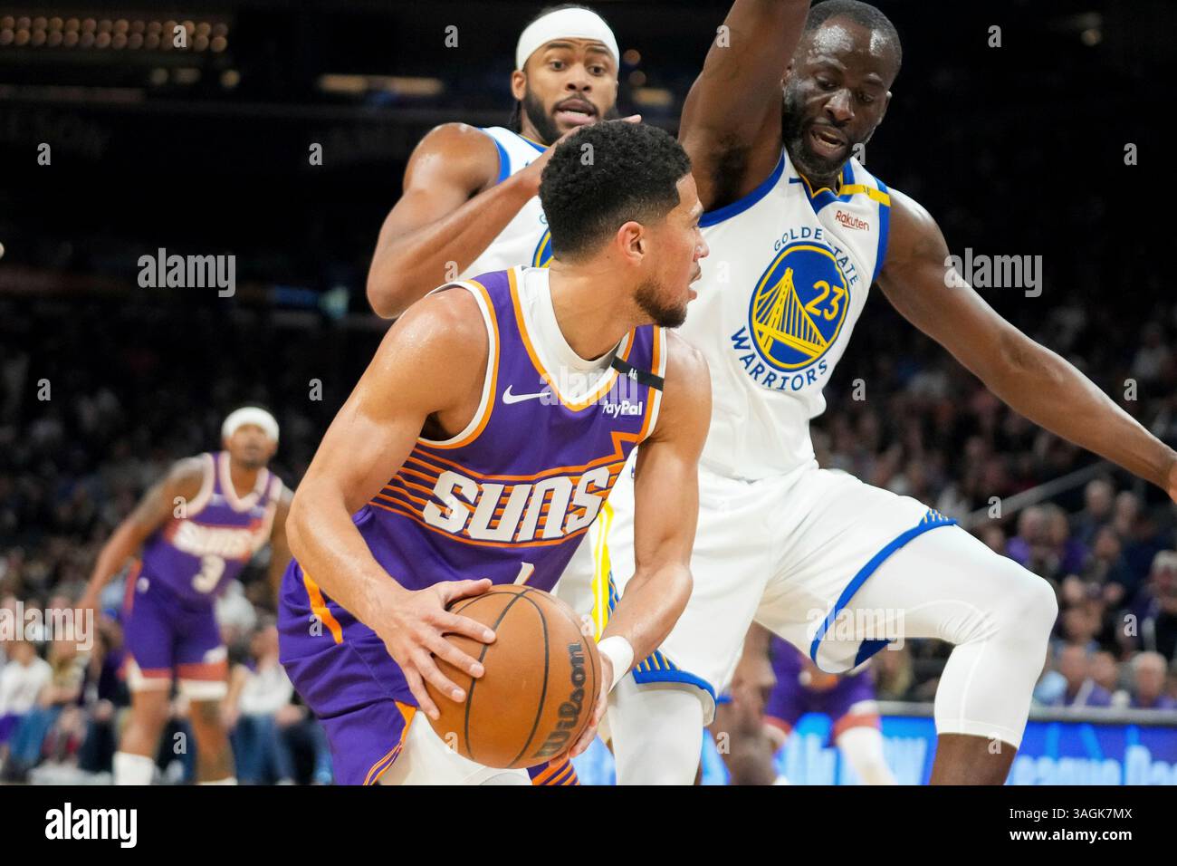 Golden State Warriors guard Moses Moody, left and Golden Draymond Green, right, double-team ...