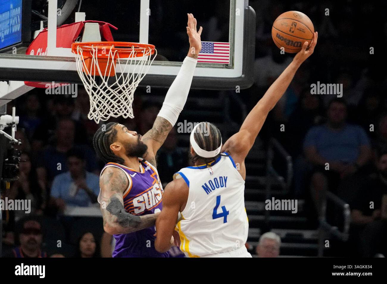 Golden State Warriors guard Moses Moody (4) shoots against Phoenix Suns ...