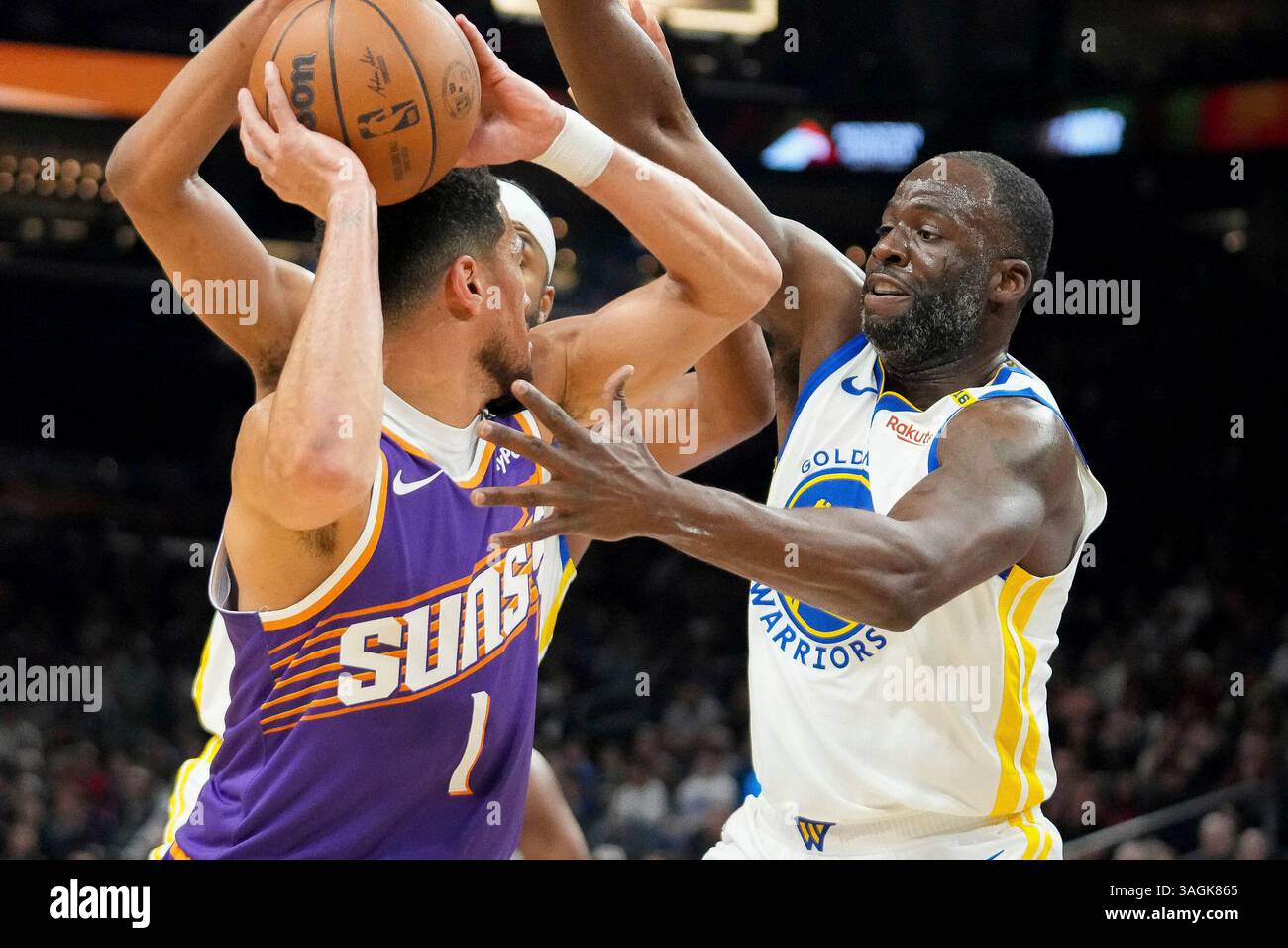 Phoenix Suns guard Devin Booker (1) is double-teamed by Golden State ...