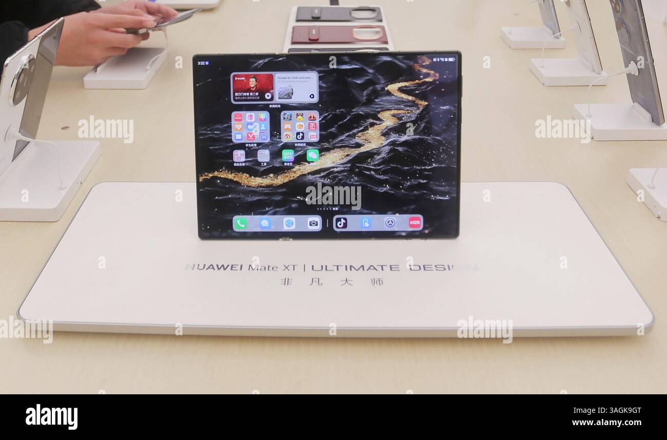 A three-fold screen mobile phone is displayed at Huawei's flagship ...