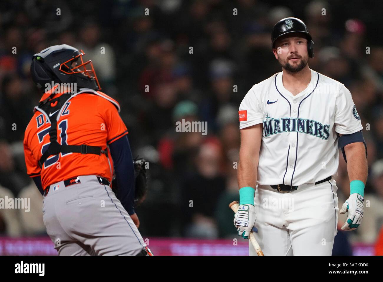Seattle Mariners designated hitter Cal Raleigh reacts to striking out ...