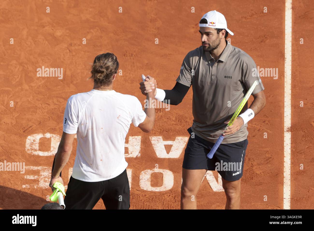 Matteo Berrettini of Italy greets Alexander Zverev of Germany (left) after his victory during ...