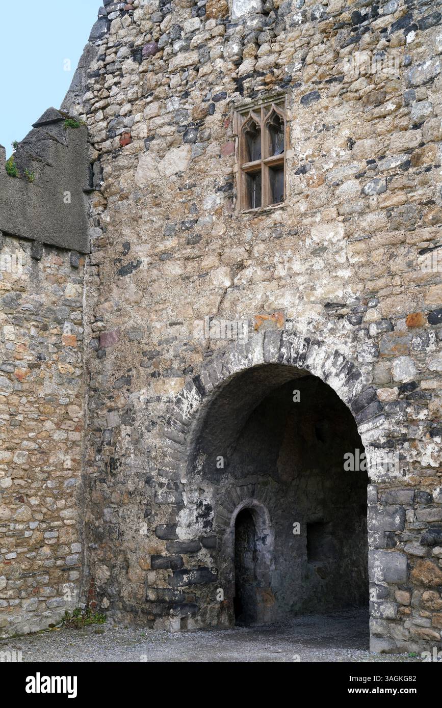 Old stone building with mysterious dark passageway through arch Stock ...