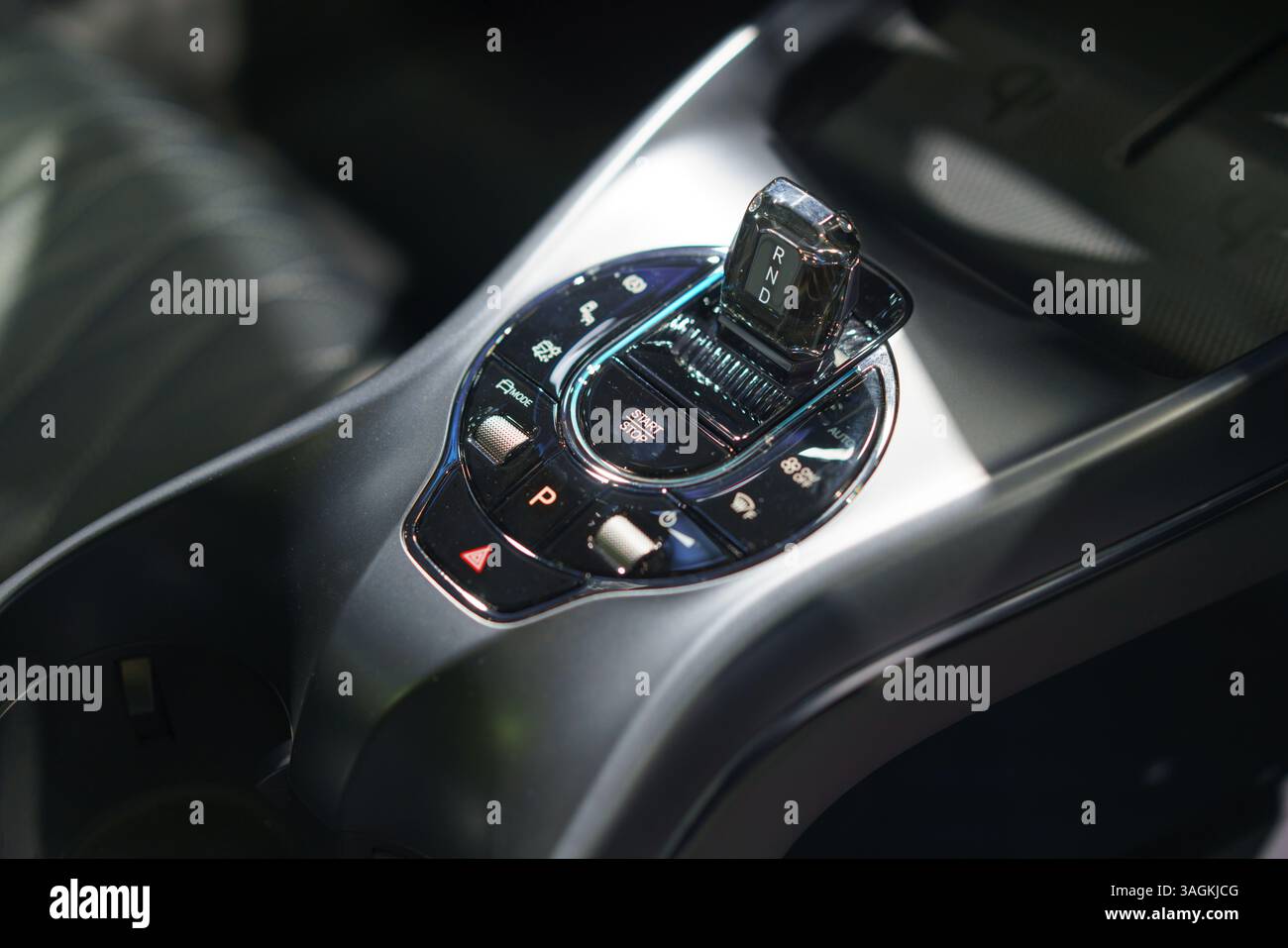 sleek center console displaying an automatic gear selector, start-stop ...