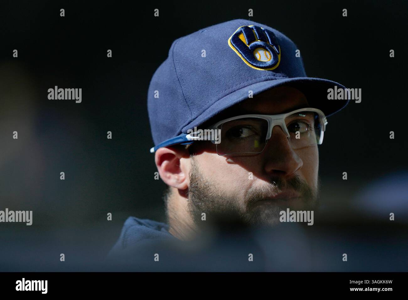 Milwaukee Brewers' Aaron Ashby looks out from the dugout during the ...