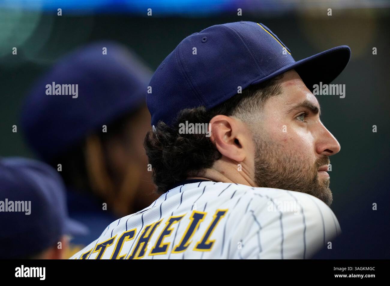 Milwaukee Brewers' Garrett Mitchell looks on from the dugout before a ...