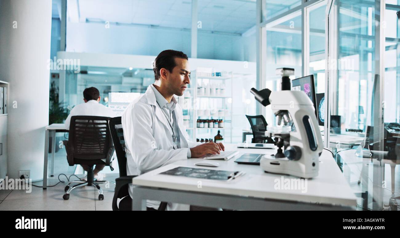 Innovation, laptop and science with man in laboratory for healthcare, medical or pharmaceutical ...