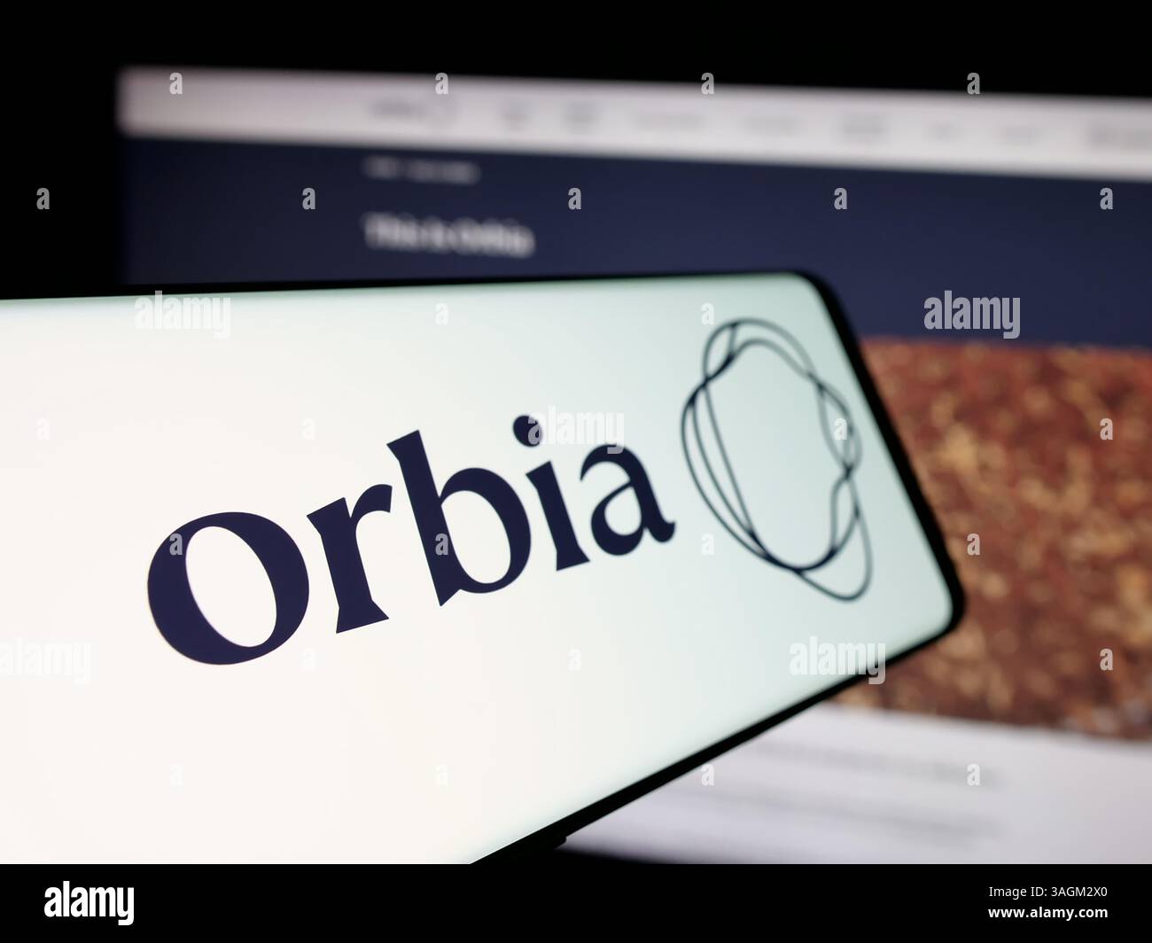 In this photo illustration, a cellphone with the logo of company Orbia ...