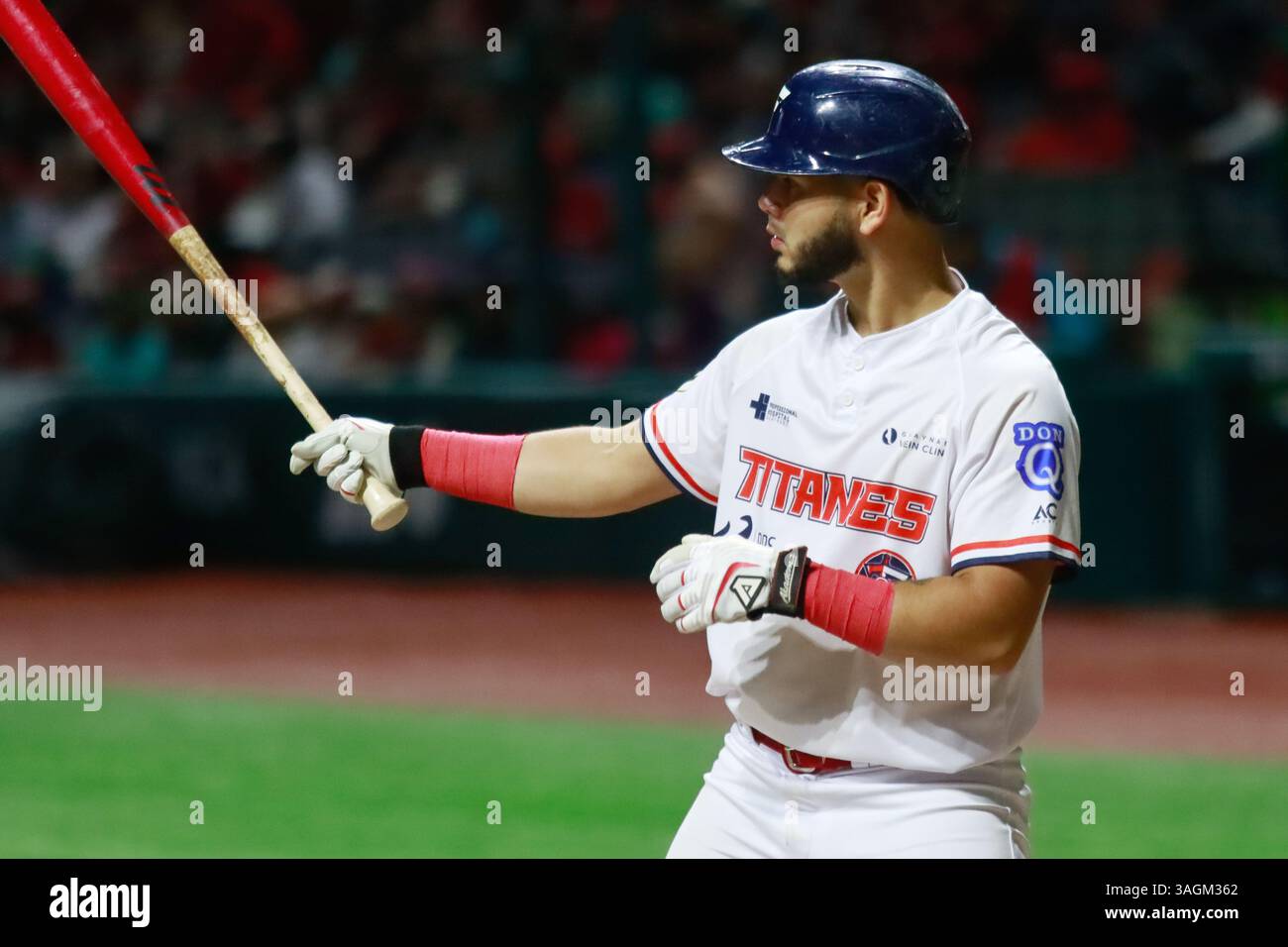Ángel Guzmán #8 of Titanes de Florida at the bat against Diablos Rojos ...