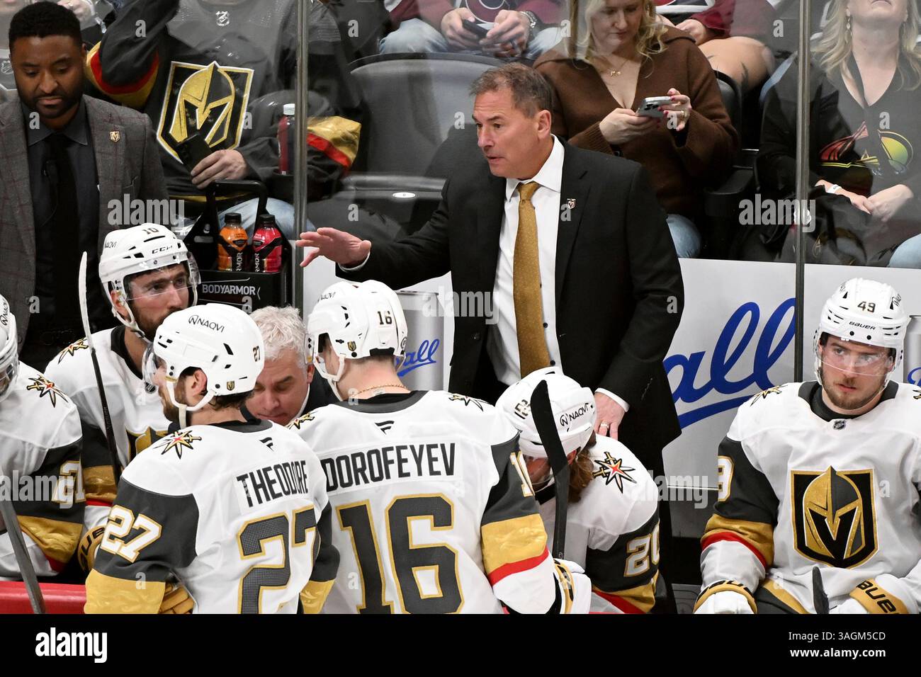 Vegas Golden Knights head coach Bruce Cassidy, middle, talks to his ...