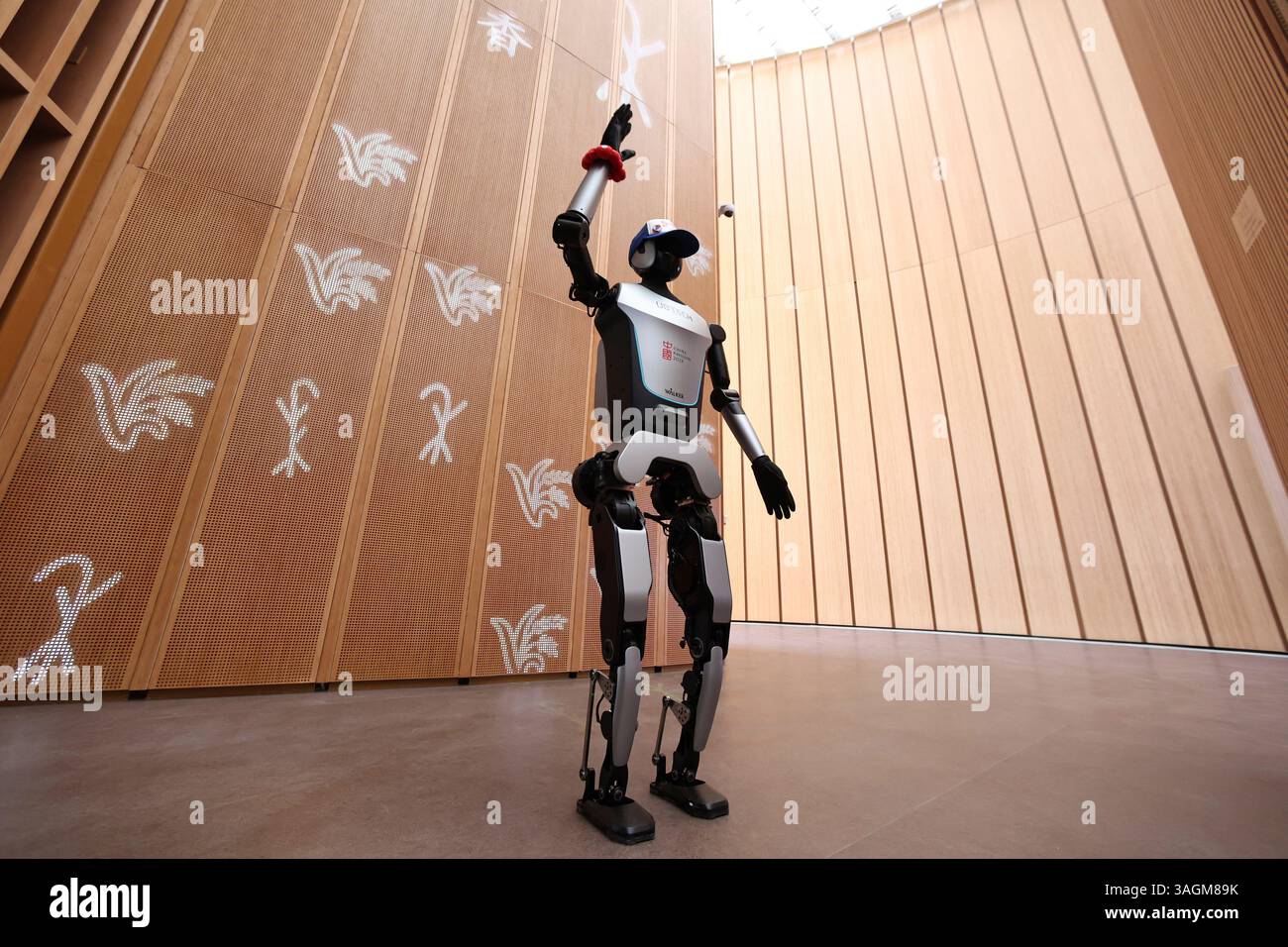 Robots greet visitors at the China Pavilion during "Media Day" at Osaka ...
