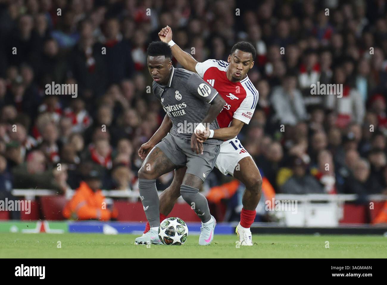 Vinicius Junior of Real Madrid and Jurrien Timber of Arsenal during the ...