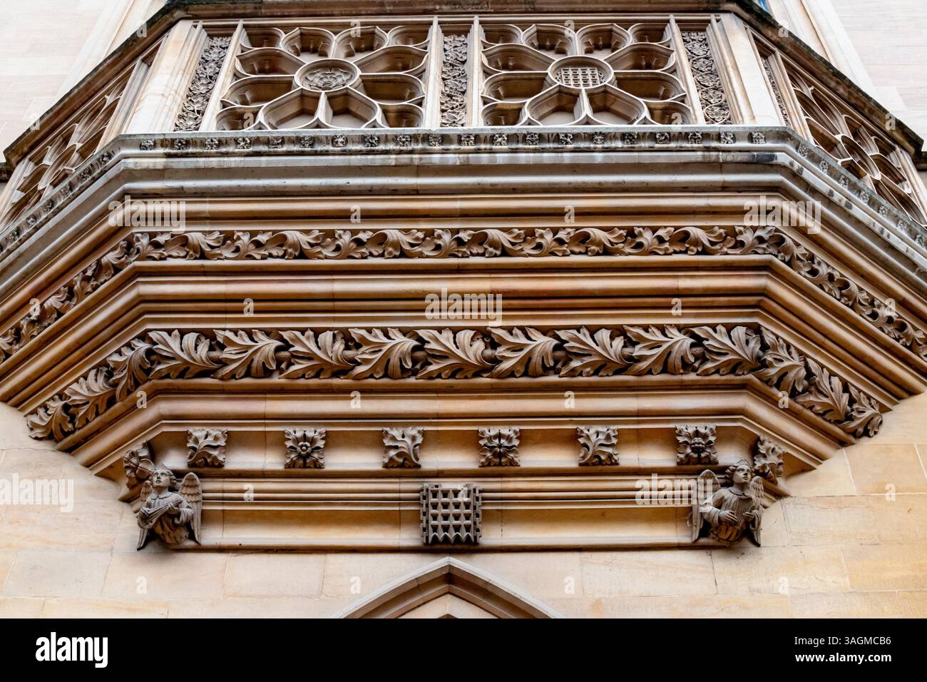 An intricately carved stonework bay window on The OId Schools building ...