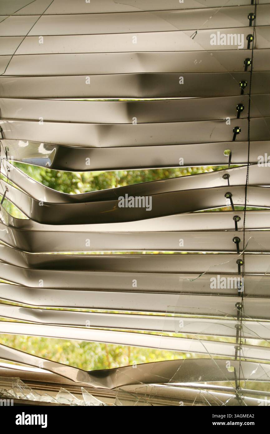 Damaged Window Blinds with Broken Glass in the abandoned house. Lost ...