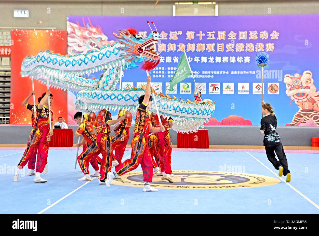 People perform at a ribbon dragon dance competition in Huainan City ...