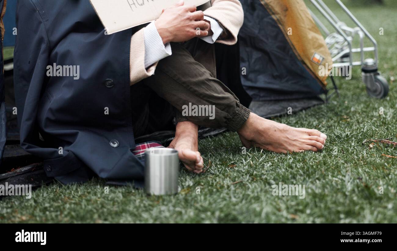 Homeless, poverty and cold with feet of person in park for depression ...